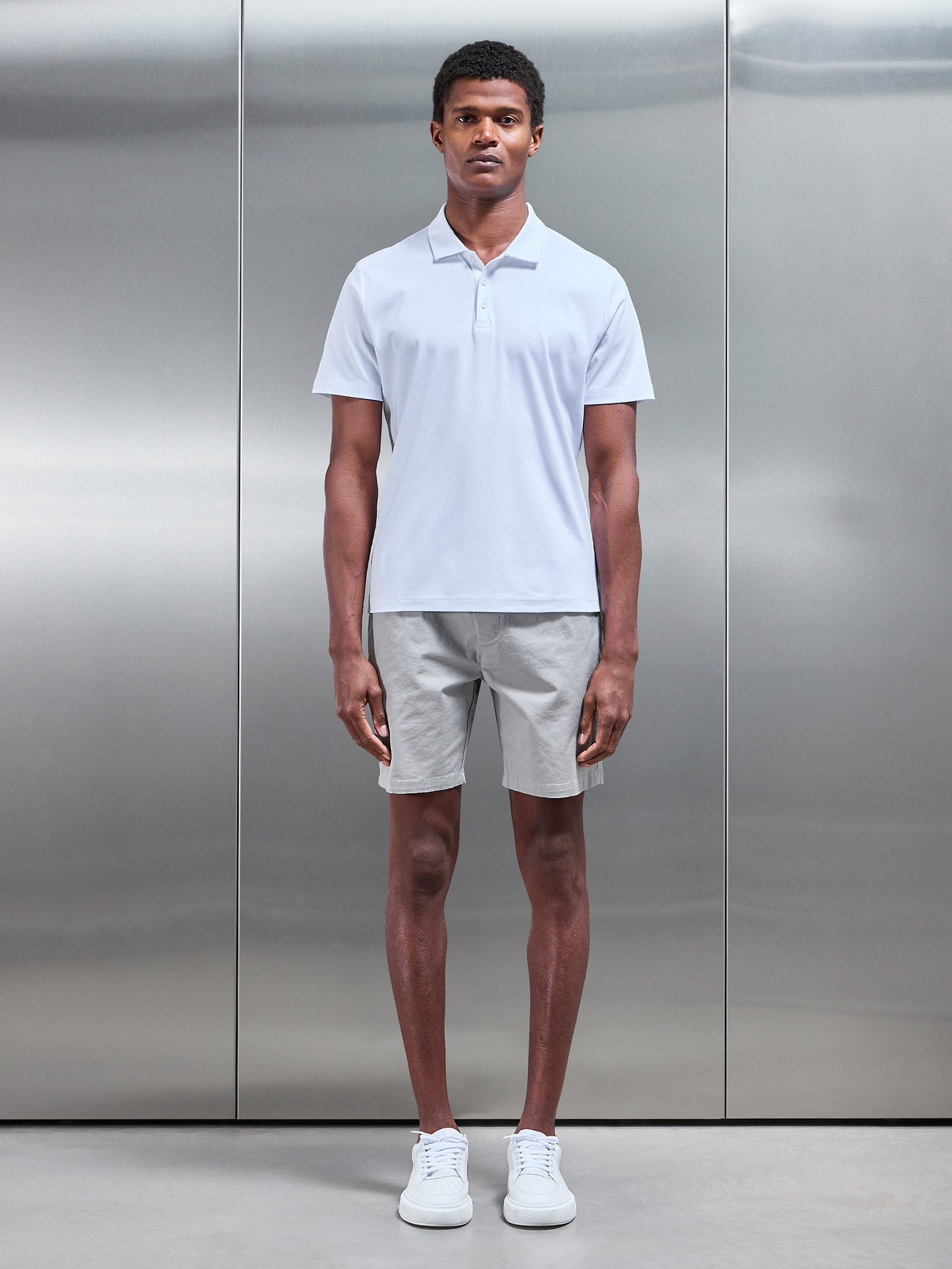 Mercerised Interlock Button Polo Shirt in White | ARNE UK
